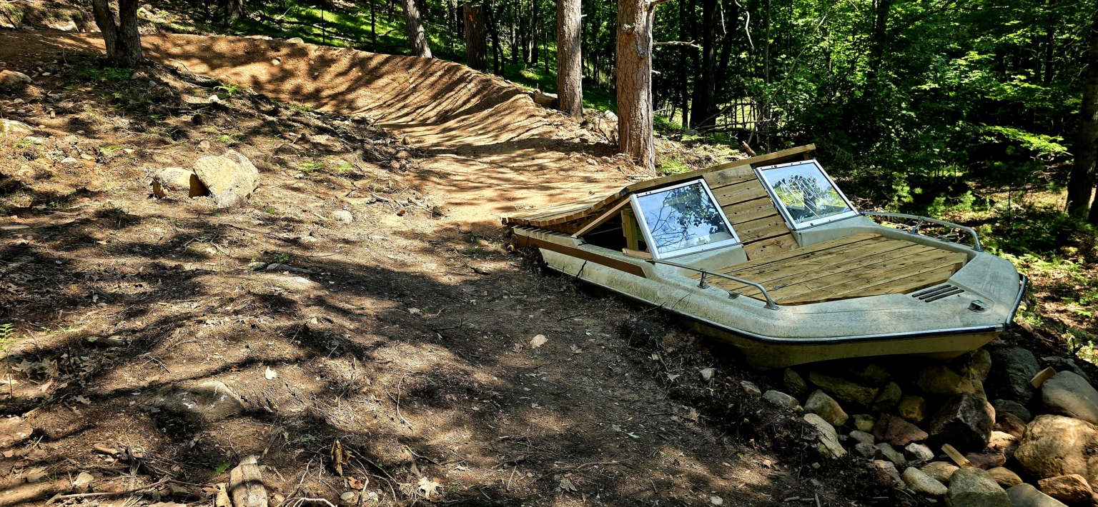 A new MTB trail system in Iron Mountain, MI, features a speed boat in a ...